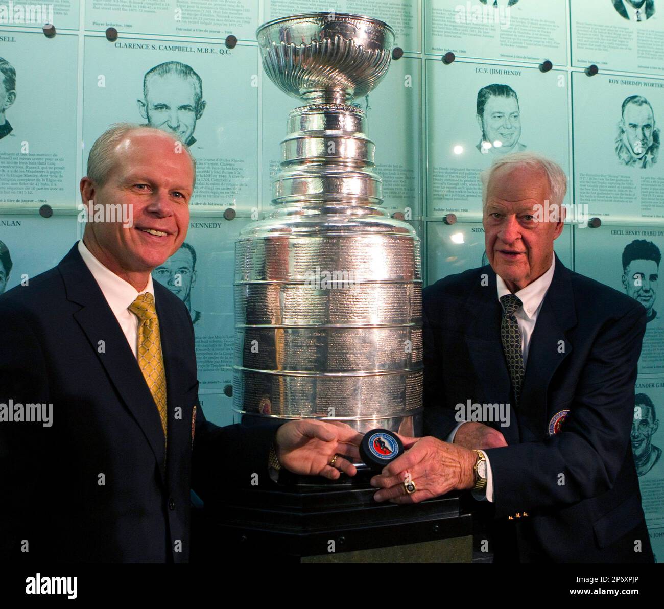 Hockey Hall of Fame inductee Mark Howe, left, poses with his father ...