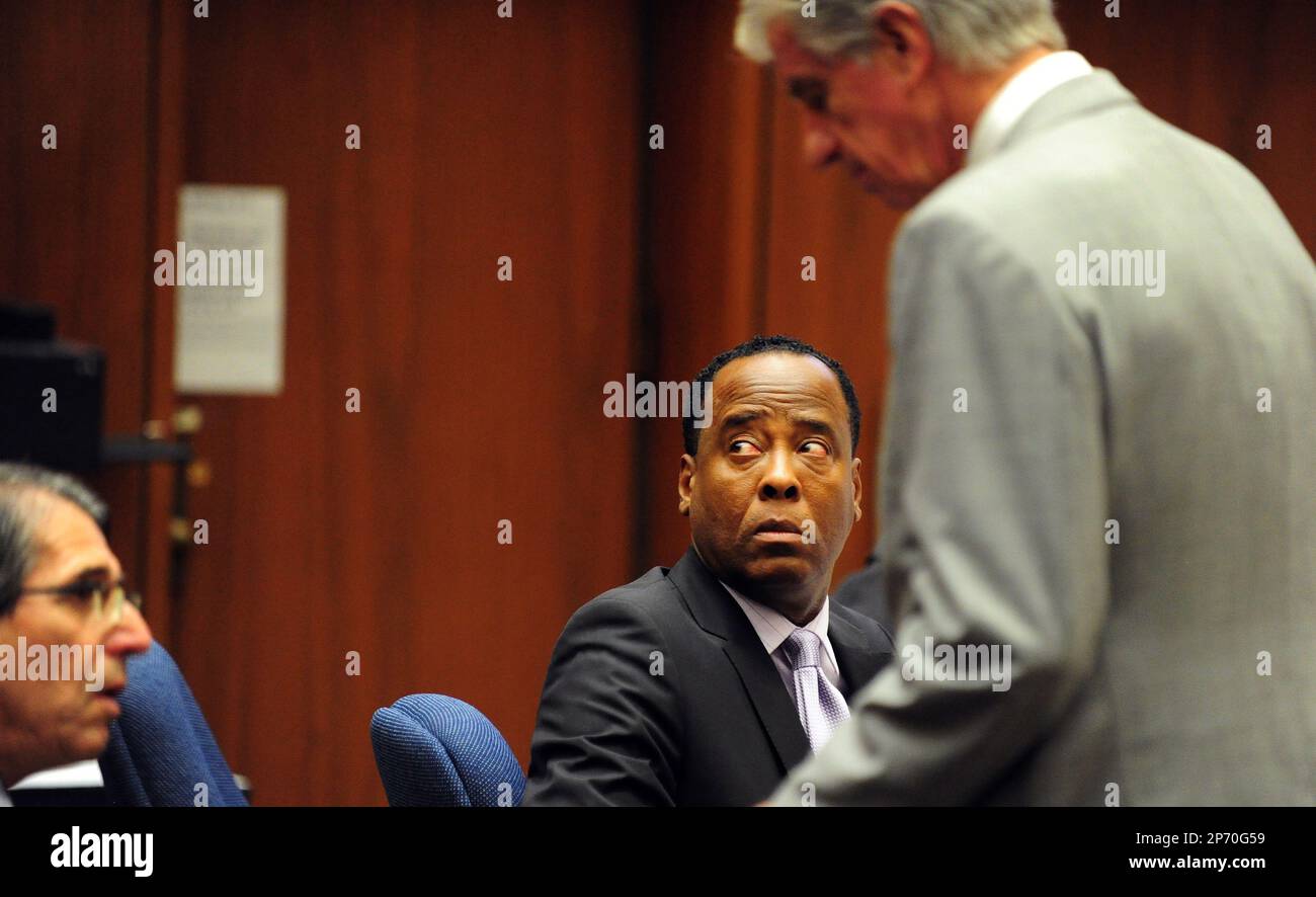 Dr. Conrad Murray looks on as Defense Attorney J. Michael Flanagan ...