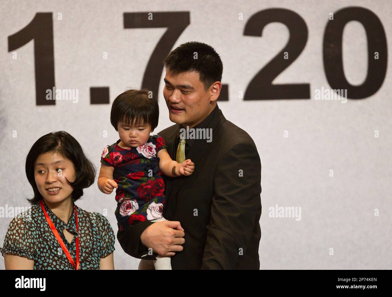 NBA star Yao Ming, right, and his daughter, and wife Ye Li pose for ...
