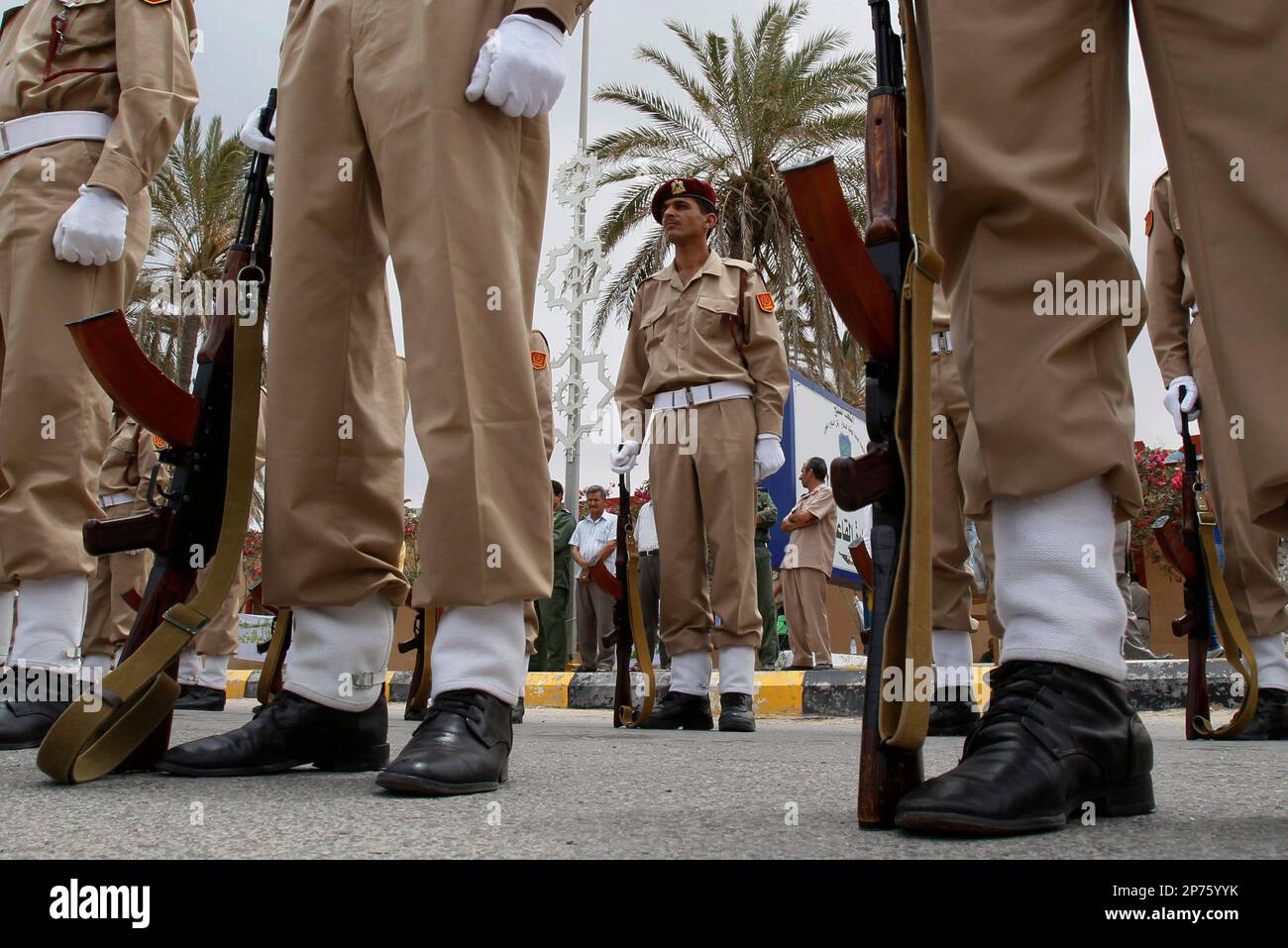 Libyan soldiers stand guard as they mark the anniversary of the ...