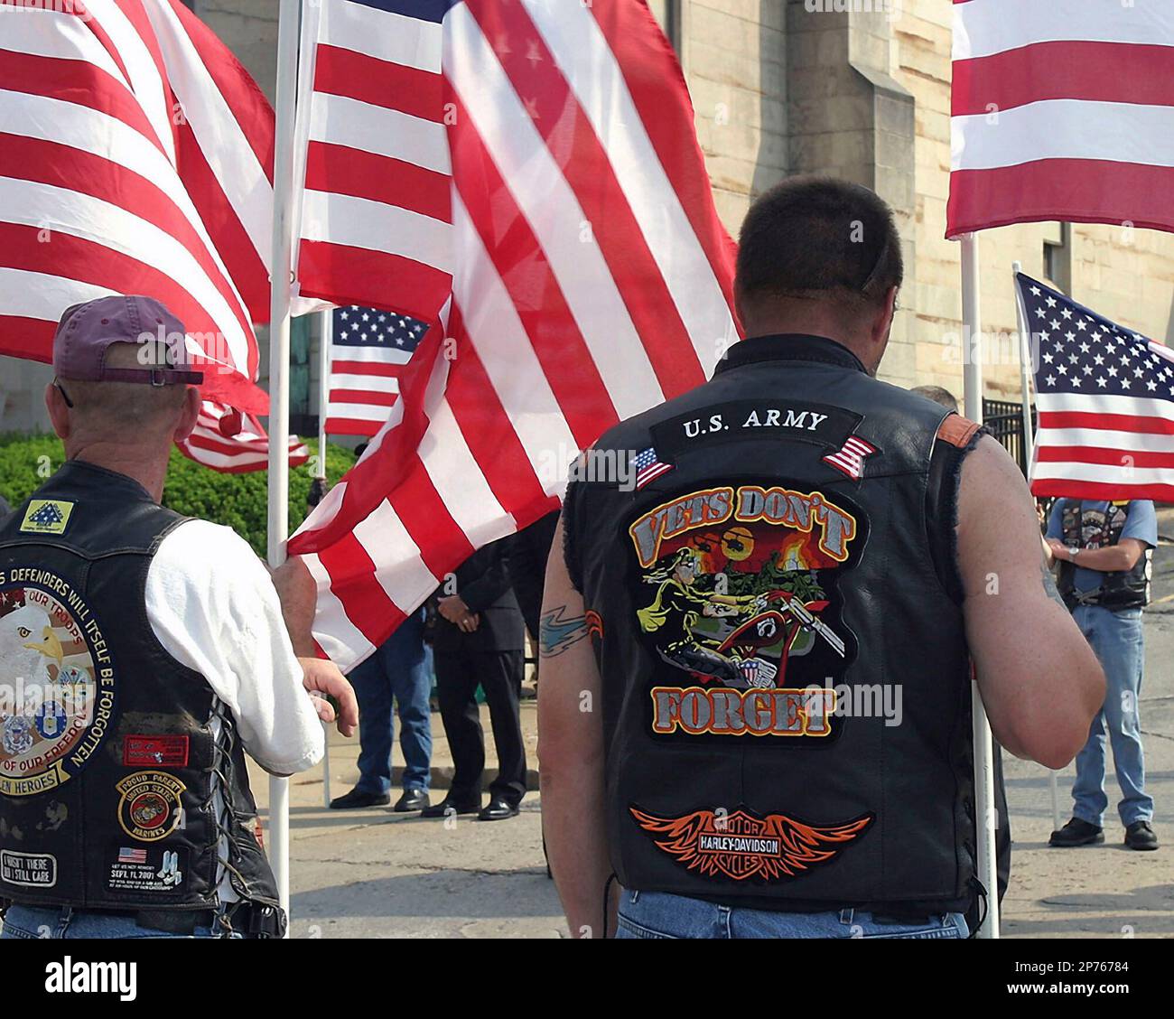 Members of the Patriot Guard present a flag line in front of St. Mary's ...