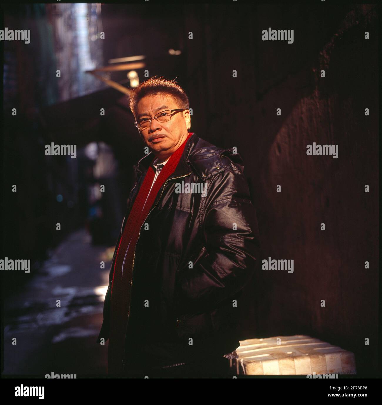 Hong Kong actor Ng Man Tat poses for photos in an alley in Kwun Tong ...