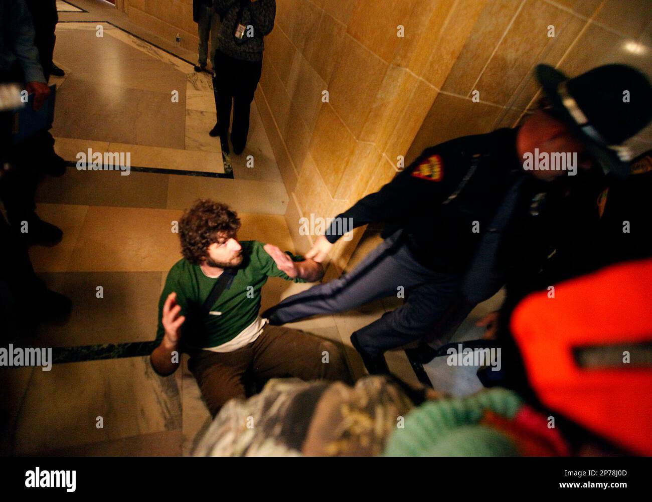 Owen Curtis is escorted out of the Wisconsin State Capitol Assembly ...
