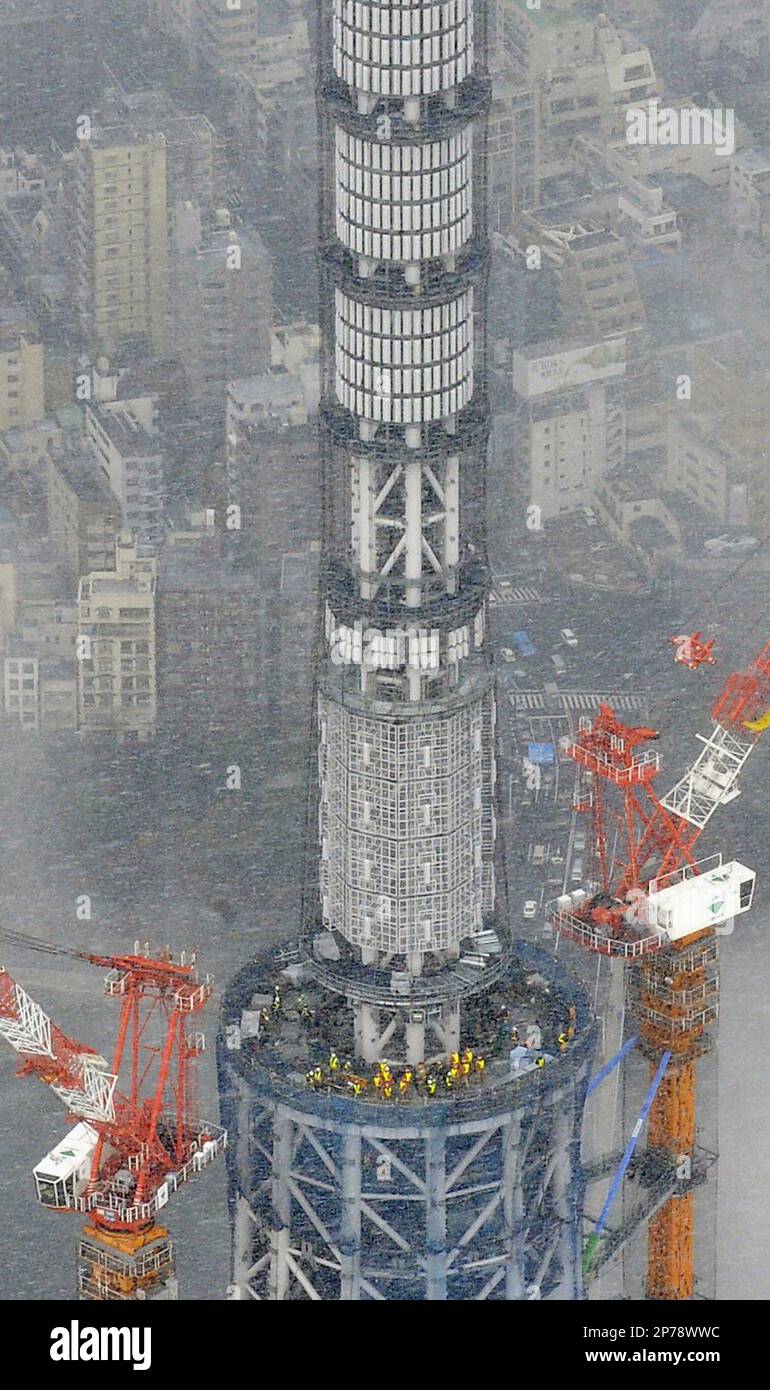 Construction workers are visible on Tokyo Sky Tree, a new landmark ...