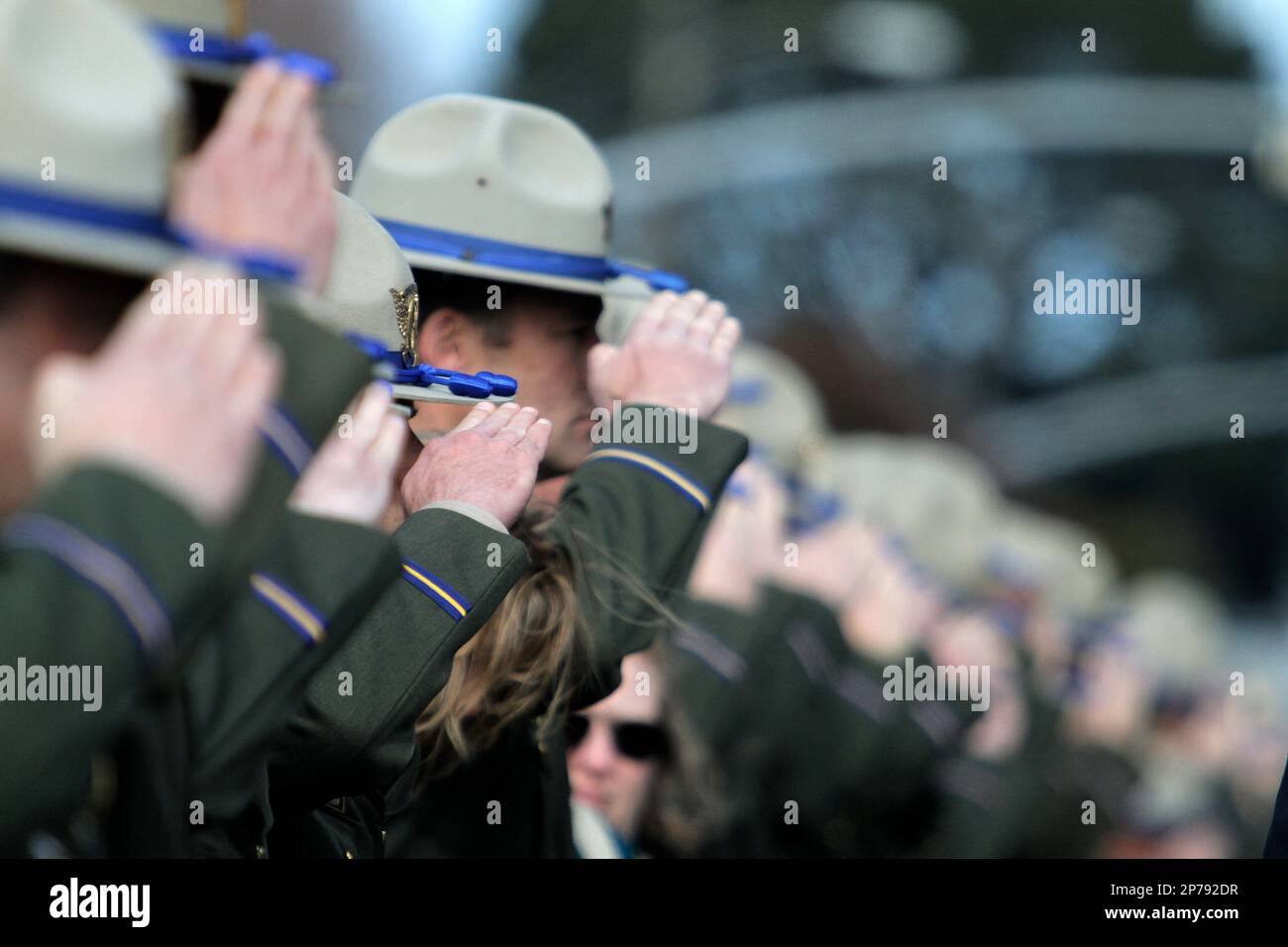 California Highway Patrol officers salute as the funeral procession ...