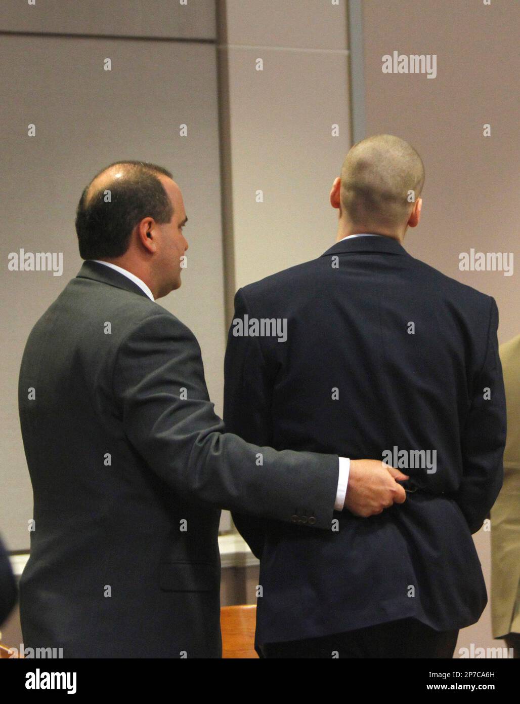 Steven Spader, right, is led from Hillsborough County Superior Court in ...