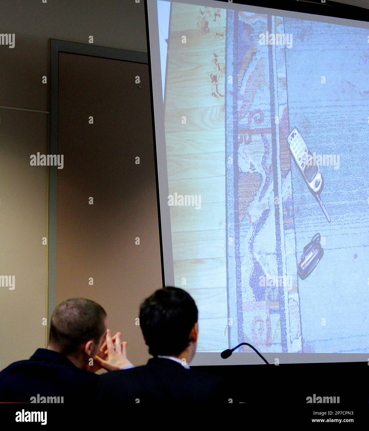 Steven Spader, left, and attorney Andrew Winters look at an evidence ...