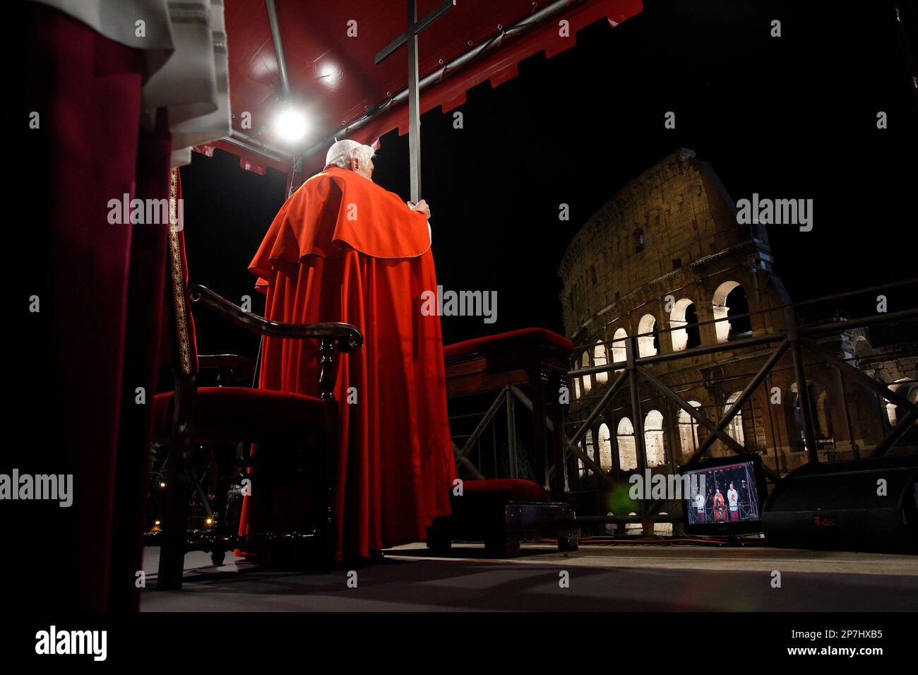 POOL - Pope Benedict XVI, with red mantle, holds the cross as he ...