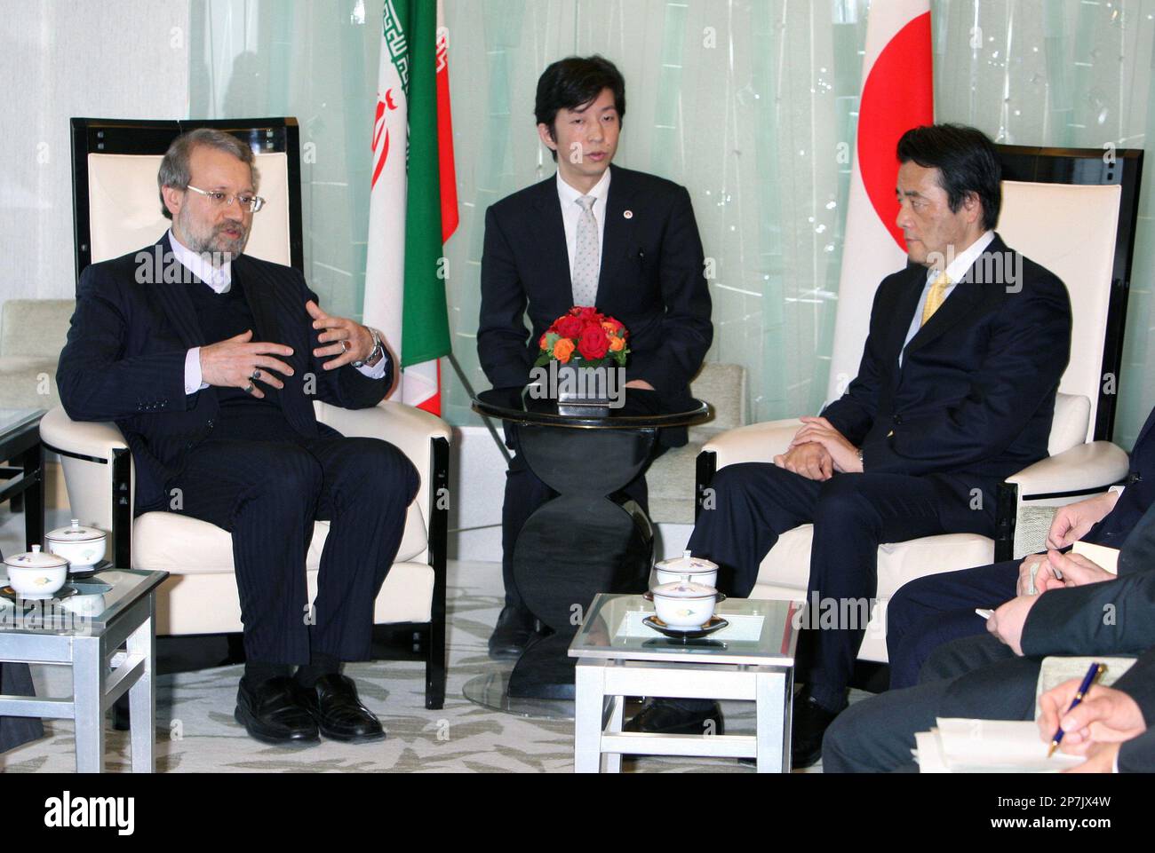 Iran's parliament speaker Ali Larijani, left, speaks with Japanese ...