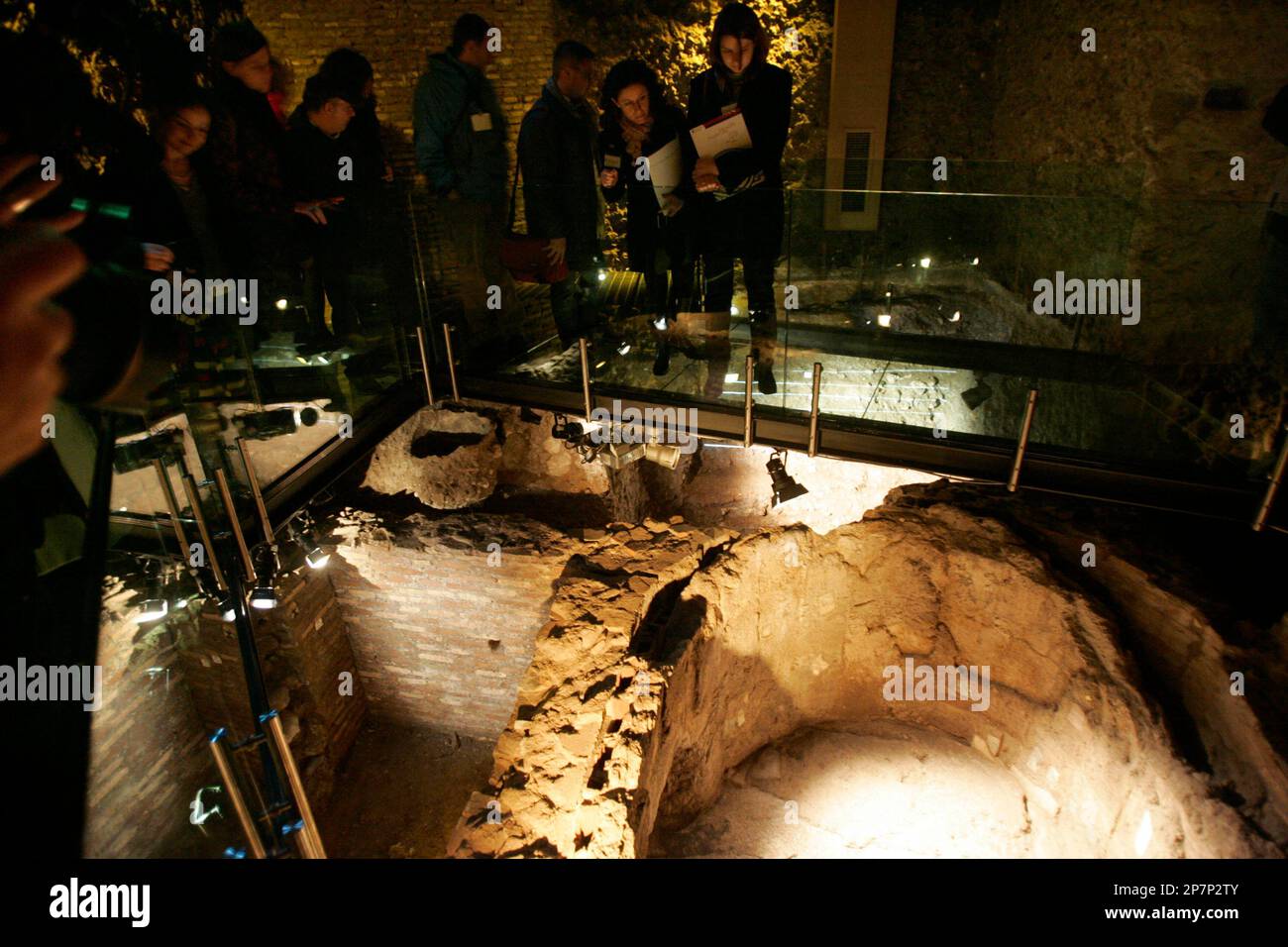 Visitors look at new discoveries unveiled in Rome, Thursday, Dec. 3 ...
