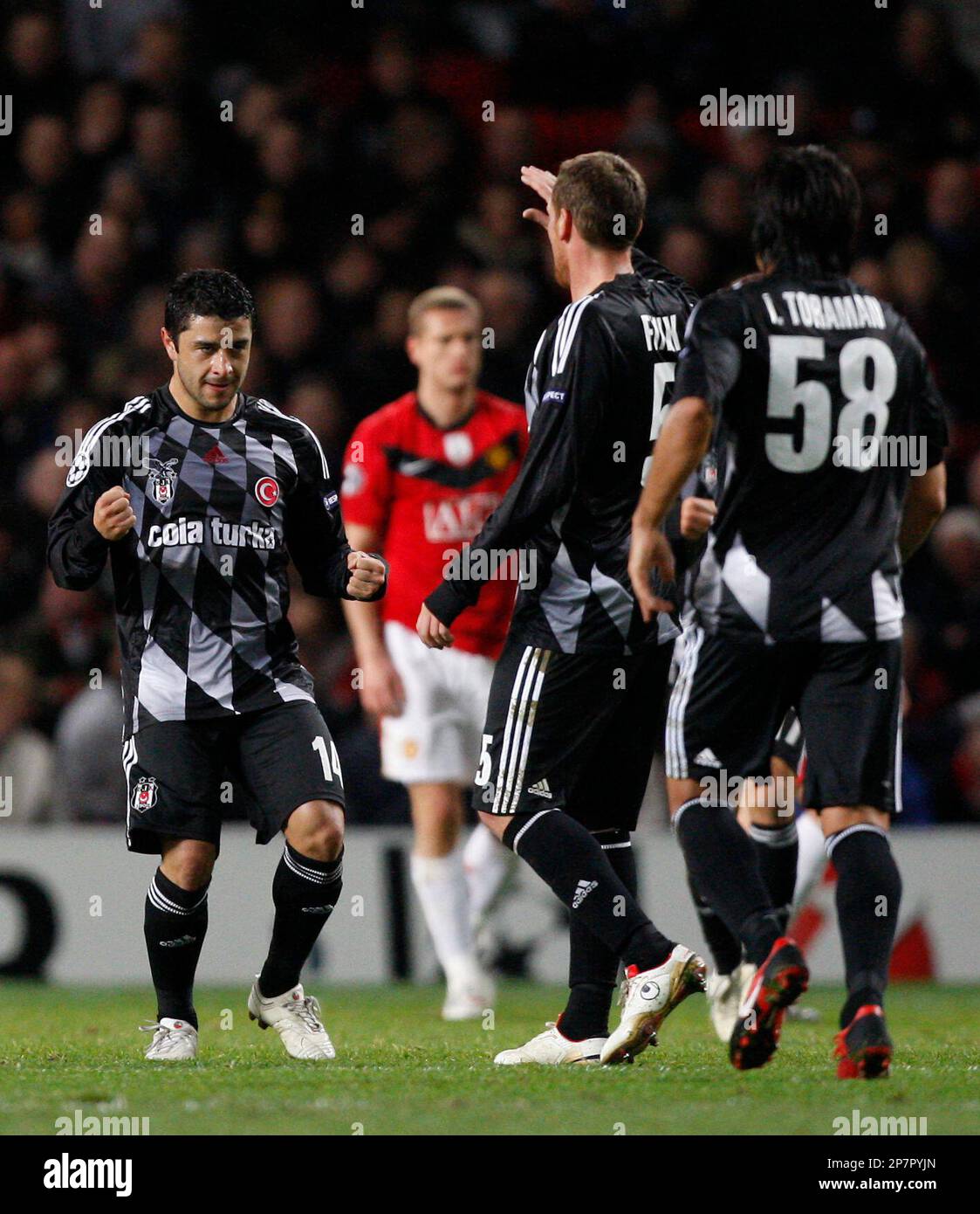 Besiktas players congratulate team mate Rodrigo Tello, left, after his ...