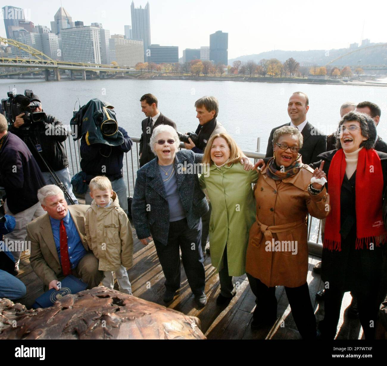 Joanne Rogers, center with sunglasses, the widow of the late Fred ...