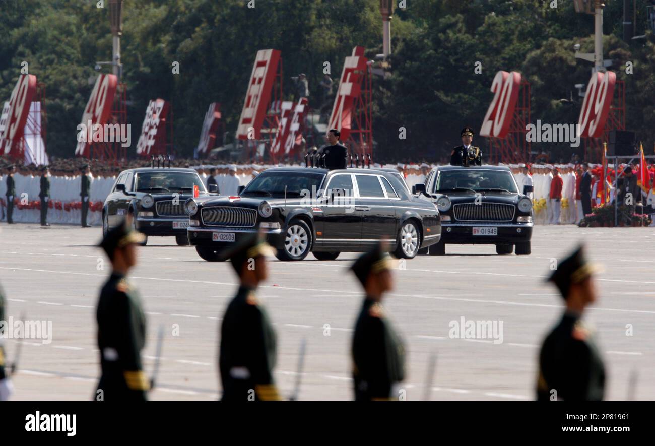 Chinese President Hu Jintao enters Tiananmen Square on an open roof ...