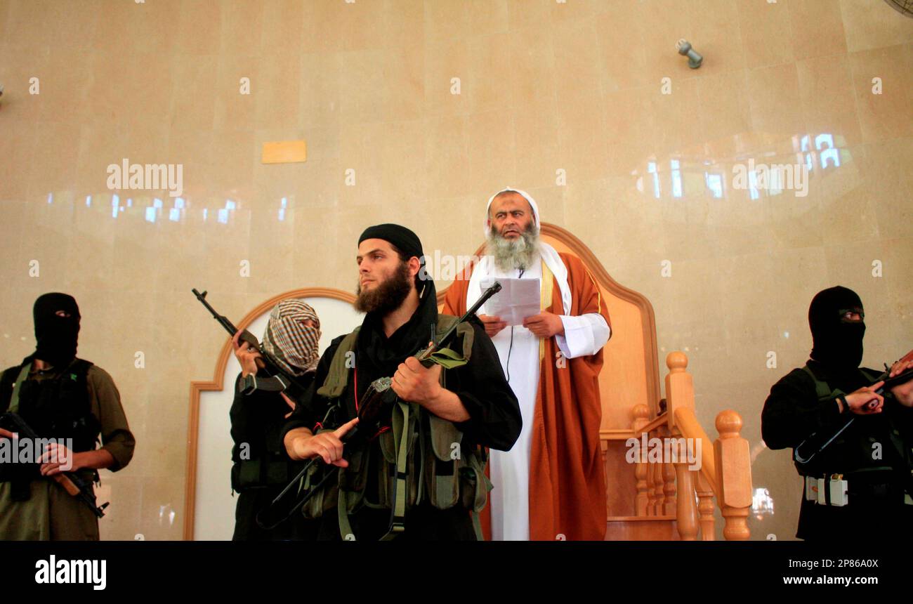 Members of a militant Islamic group Jund Ansar Allah, surround their ...