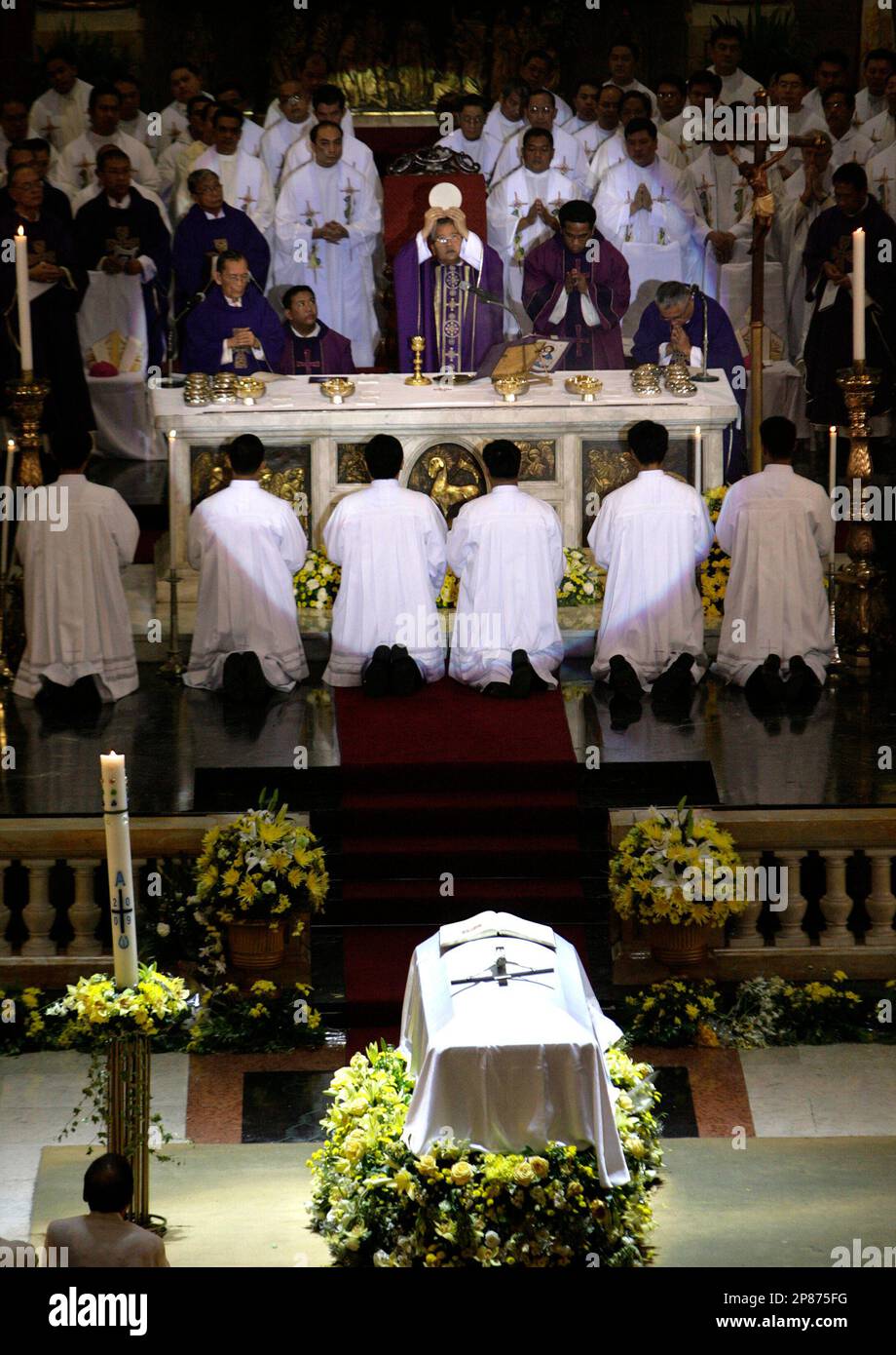 Priests celebrate requiem mass for the late former Philippine President ...
