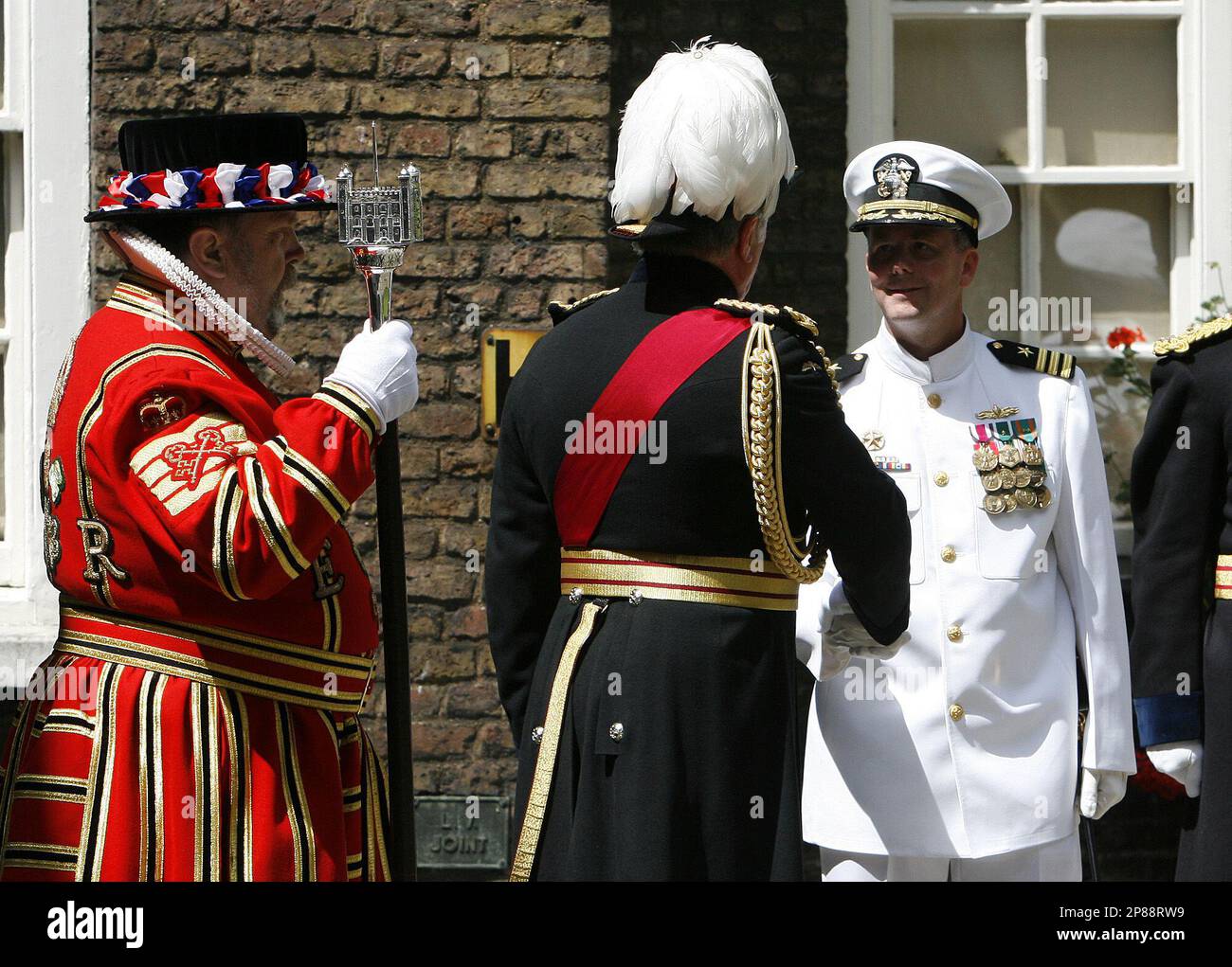 The captain of the USS Halyburton Commander Michael P. Huck, right ...