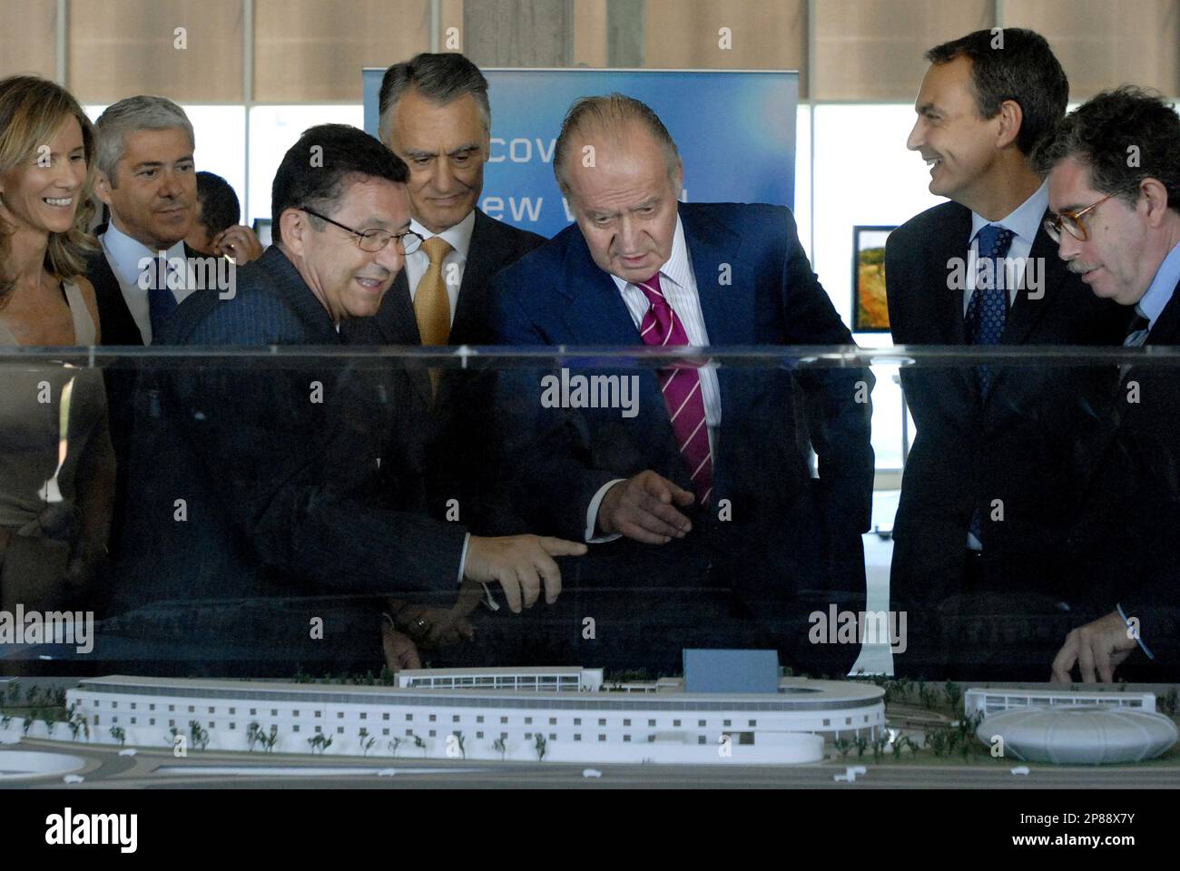 Spain's King Juan Carlos, center, is shown a model of the Iberian ...
