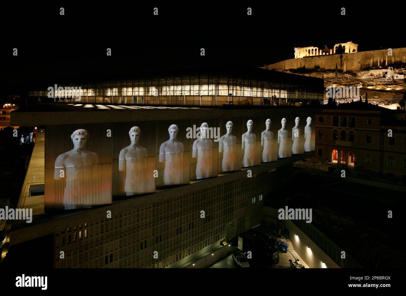 Photos of the so-called Kritios Boy statue are projected onto the walls ...