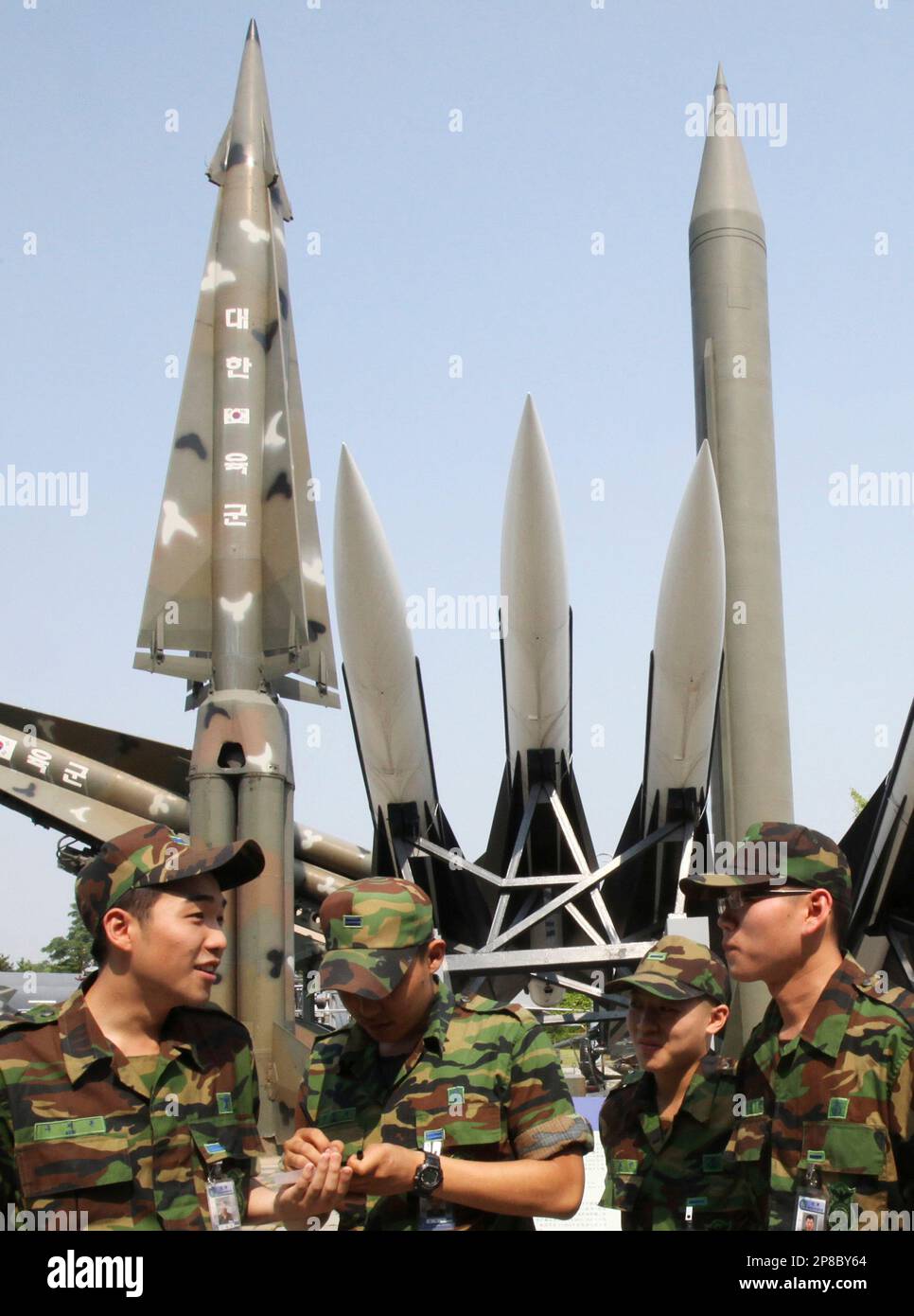 South Korean military soldiers stand by displays of models of North ...
