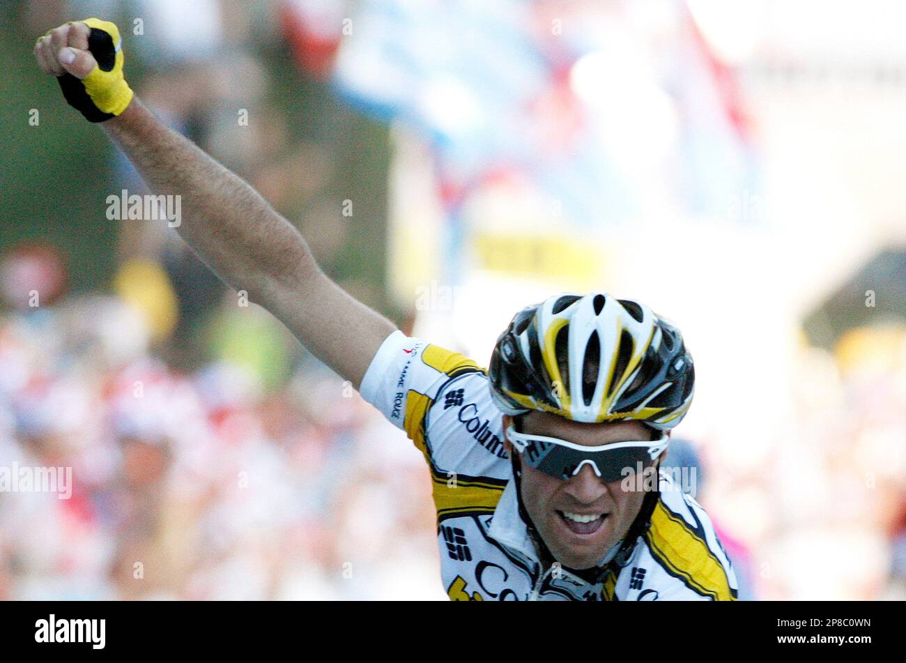 Switzerland's Michael Albasini from team Columbia-High Road, raises his ...