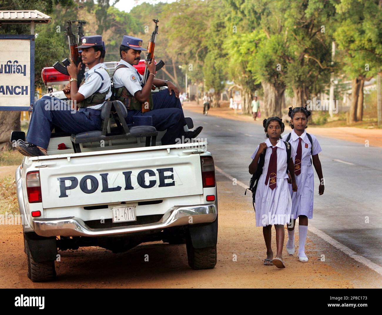 FILE- In this June 21, 2006 file photo, school girls walk past ...