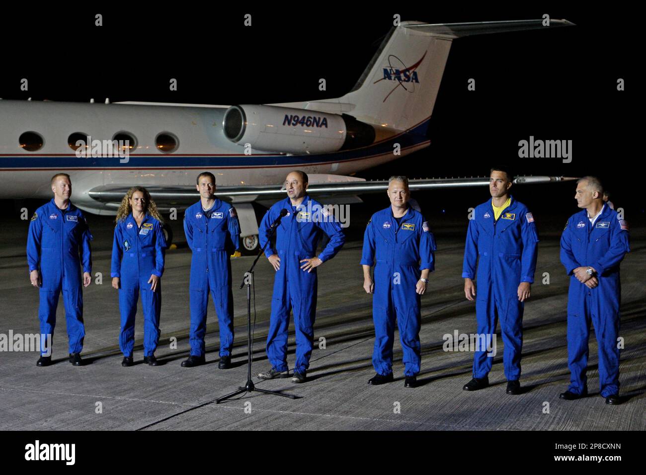 Space shuttle Endeavour commander Mark Polansky, center at microphone ...