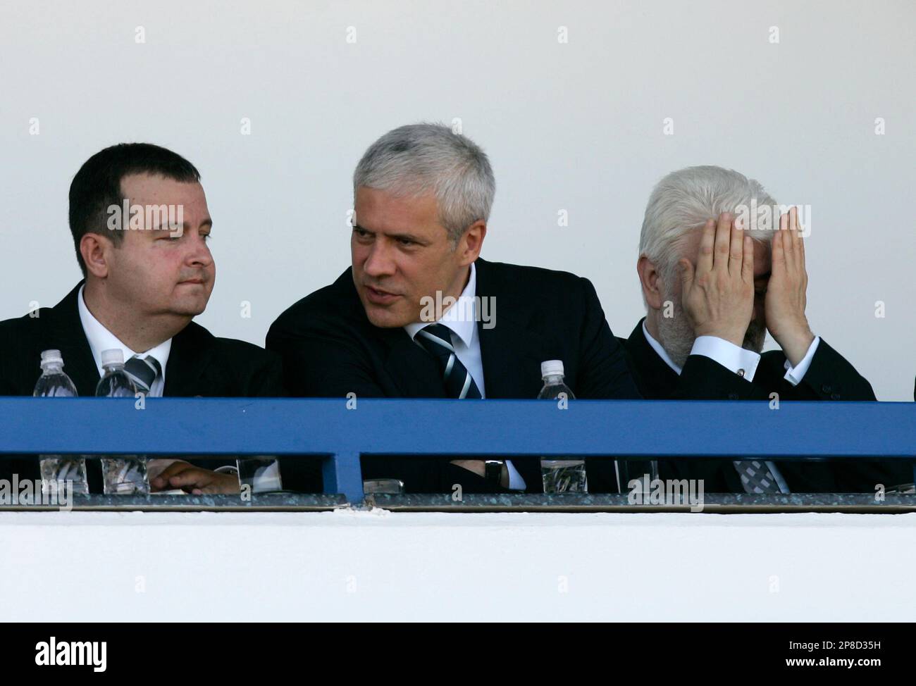 Serbian President Boris Tadic, center, speaks with Interior Minister ...