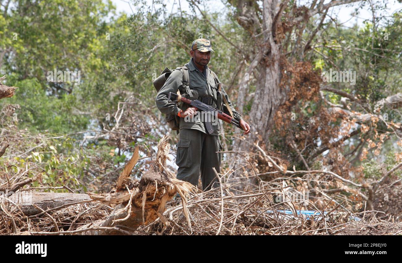 A government soldier stands guard at Manik Farm displaced persons camp ...
