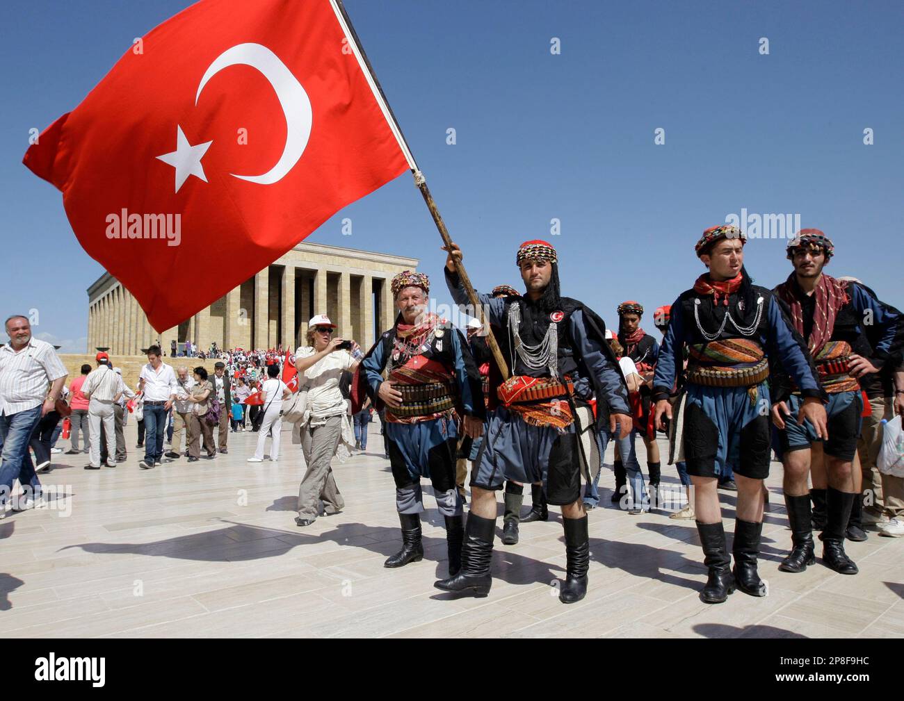 People in traditional dresses called "Efe" from the Aegean region leave ...