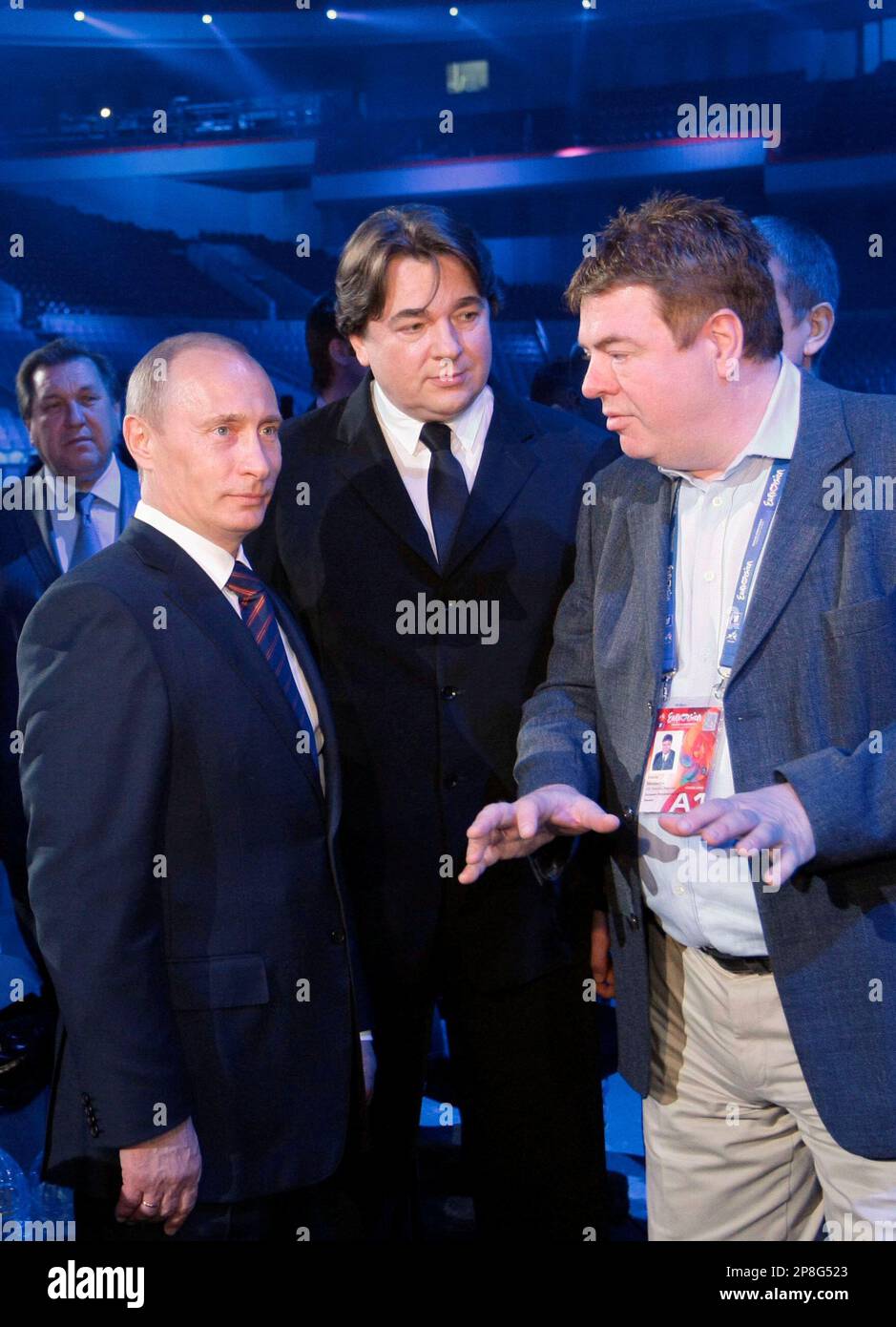 Russian Prime Minister Vladimir Putin, left, speaks with Executive ...