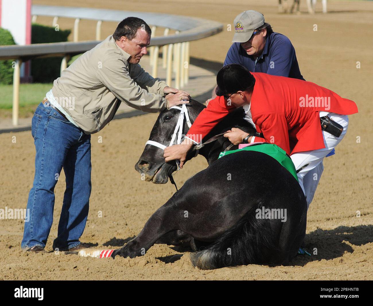 ** FILE ** In this May 3, 2008, file photo, track personnel try to hold ...