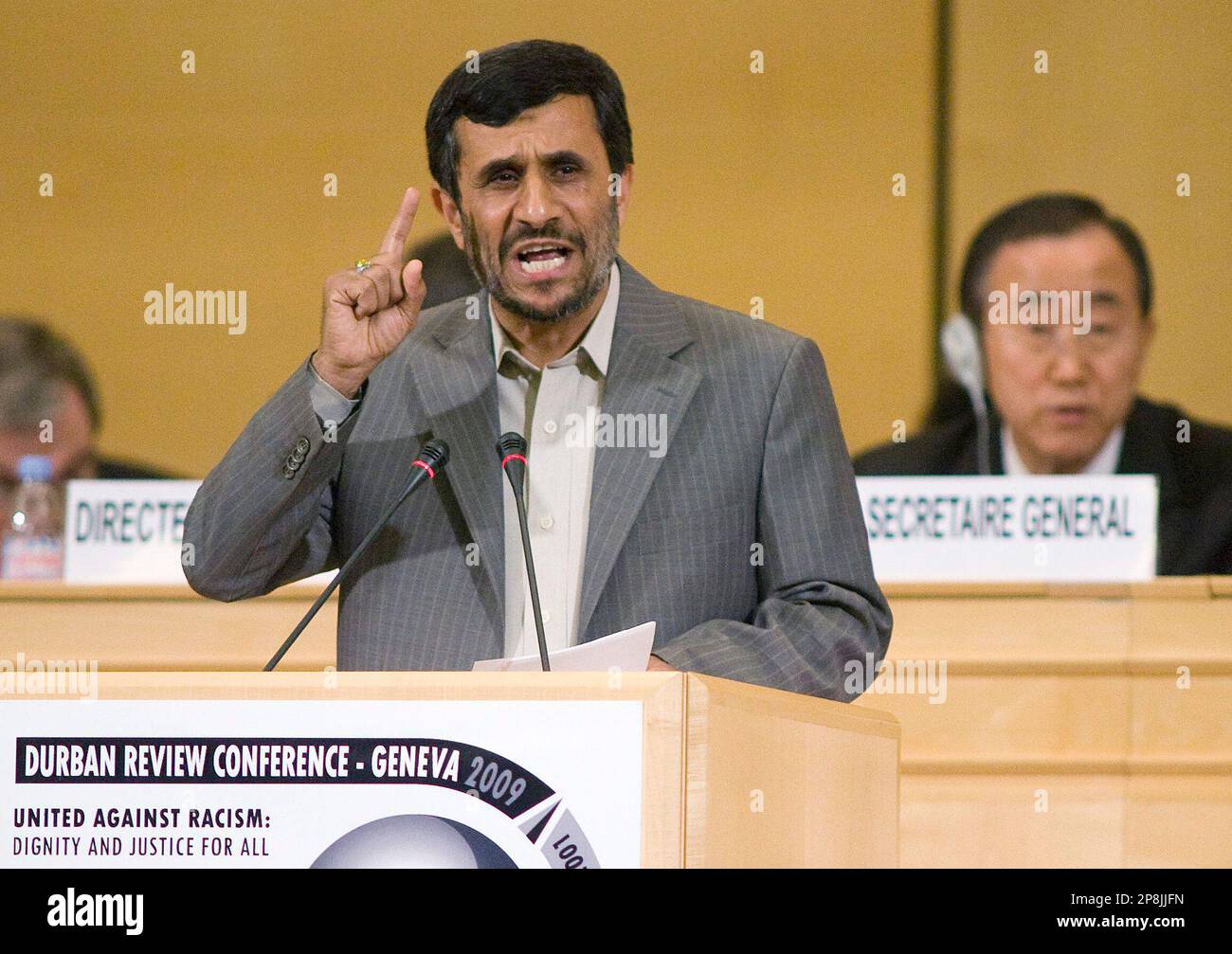 Iranian President Mahmoud Ahmadinejad, left, delivers his speech in ...