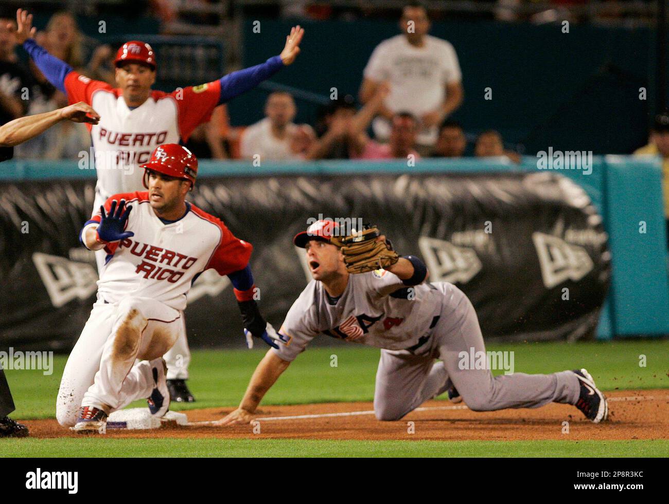 Puerto Rico's Ramon Vazquez, left, is safe at third on a single hit by ...