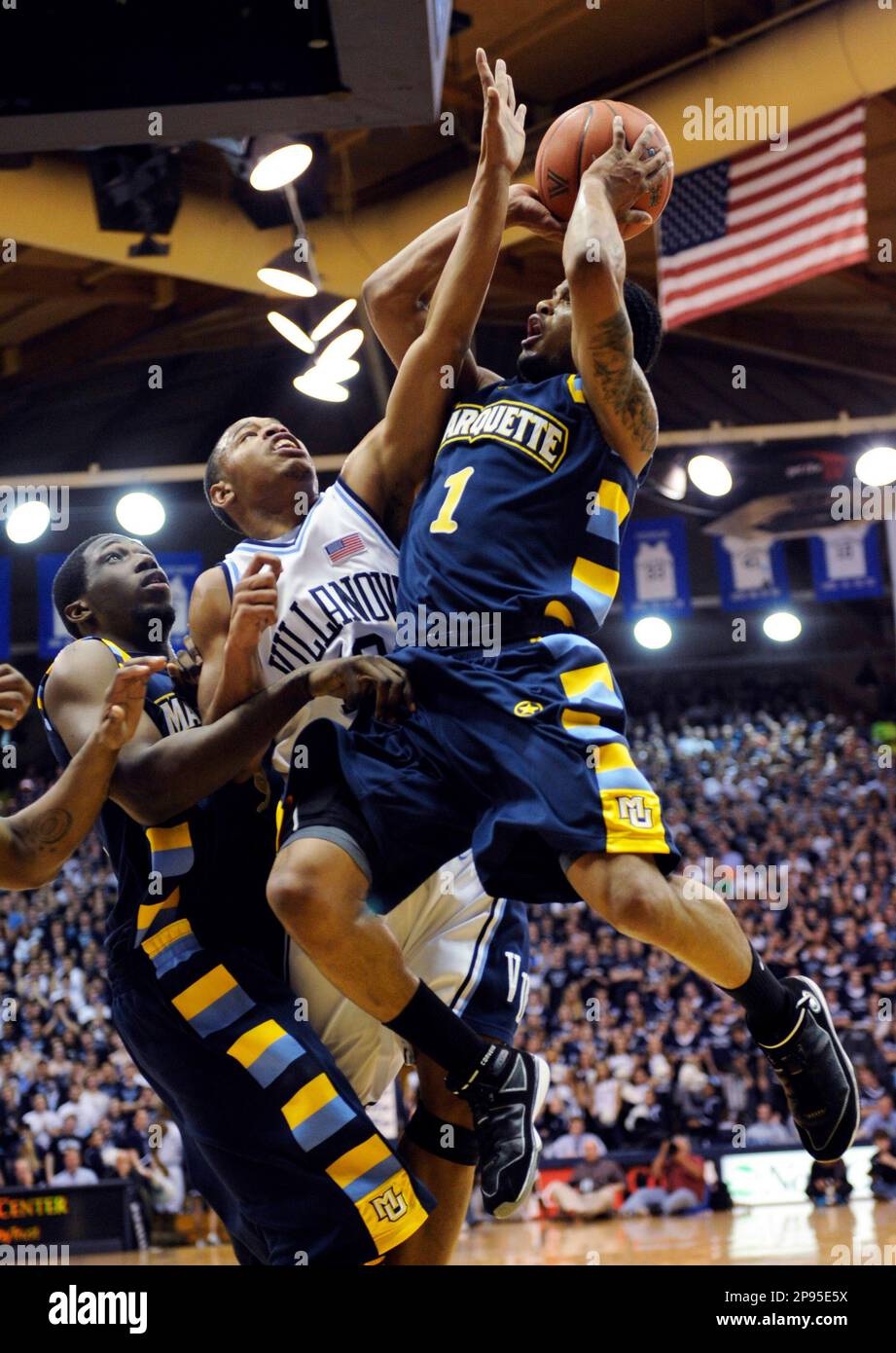 Marquette's Dominic James (1) shoots over Villanova's Corey Fisher (10 ...