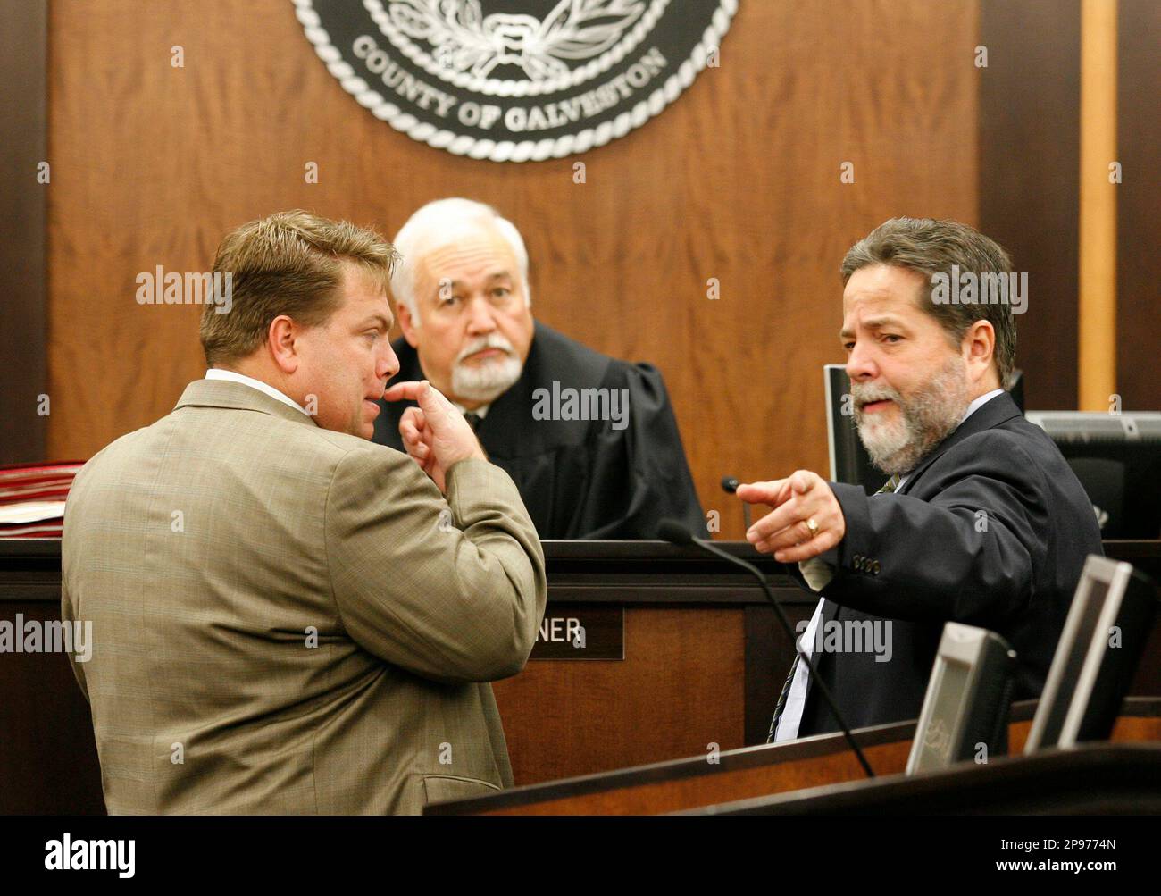 Judge David Garner, center, speaks with defense attorney Tom Stickler ...