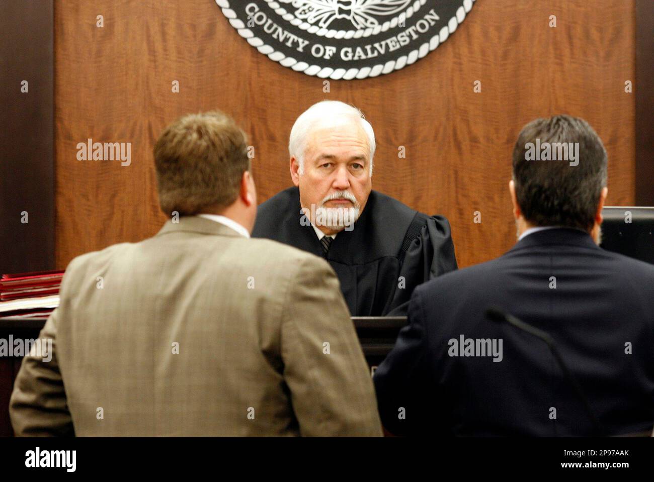 Judge David Garner, center, speaks with defense attorney Tom Stickler ...