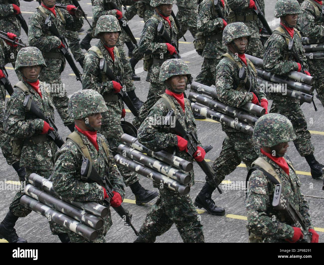 Philippine Marines march past the grandstand with their weapons and in ...