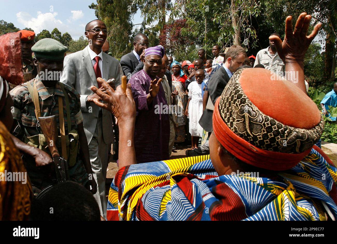 UN special envoy, former Nigerian President Olusegun Obasanjo, centre ...