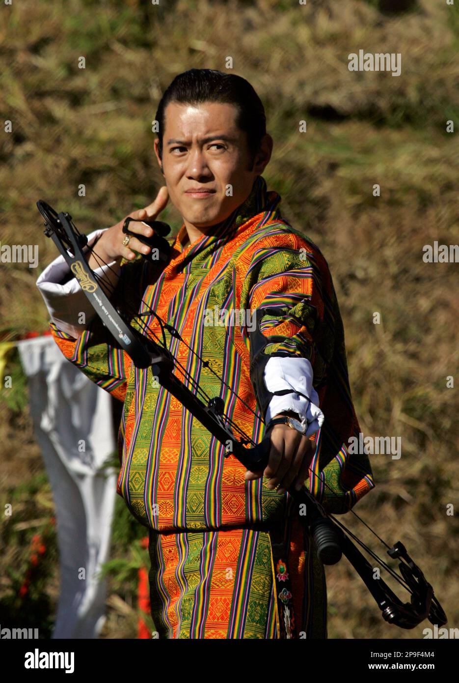 Bhutan's fifth King Jigme Khesar Namgyal Wangchuk follows an arrow ...