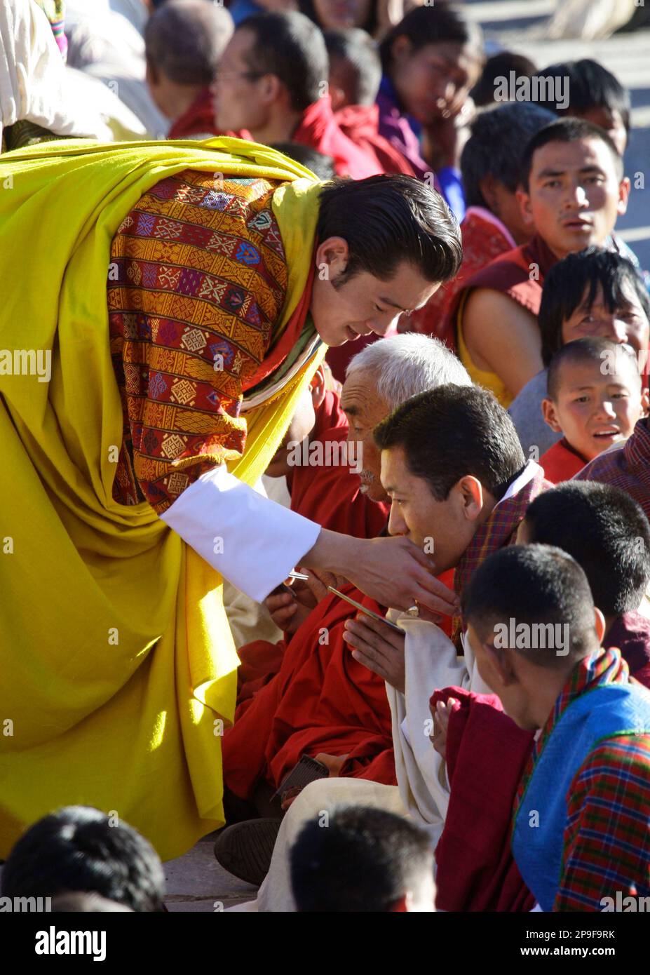 Bhutan's 5th King Jigme Khesar Namgyal Wangchuk, left, interacts with ...