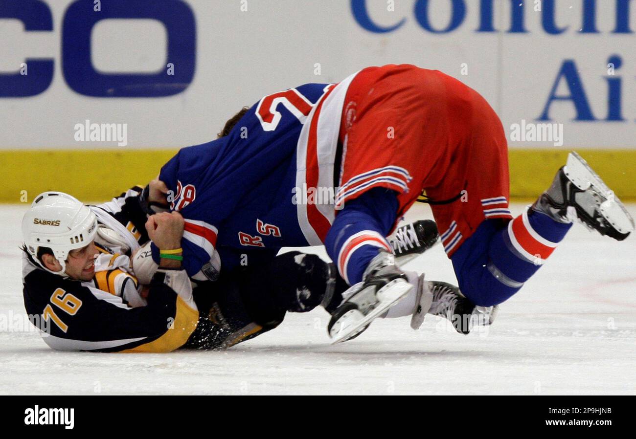 Buffalo Sabres left wing Andrew Peters (76) and New York Rangers right ...