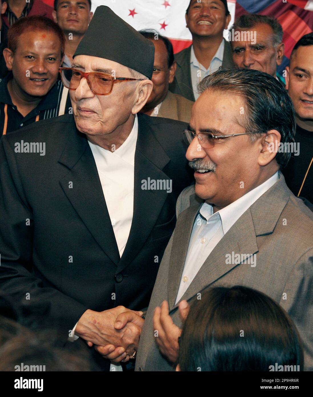 Nepal's Prime Minister Pushpa Kamal Dahal Prachanda, right, shakes hand ...