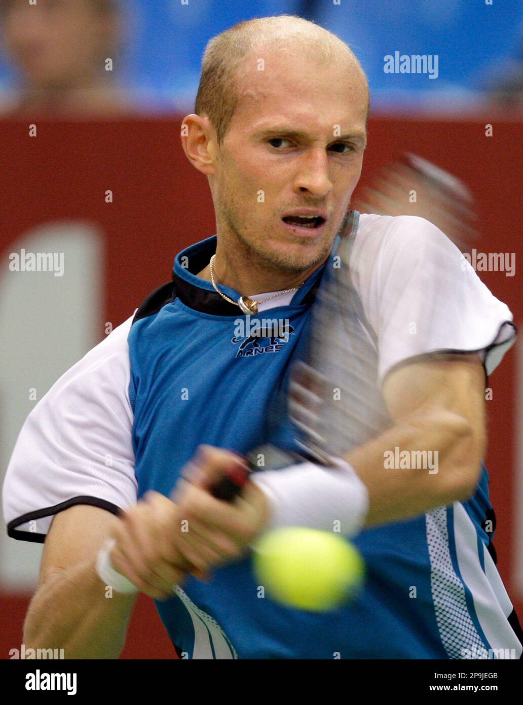 Russia's Nikolay Davydenko returns a shot to France's Florent Serra at ...