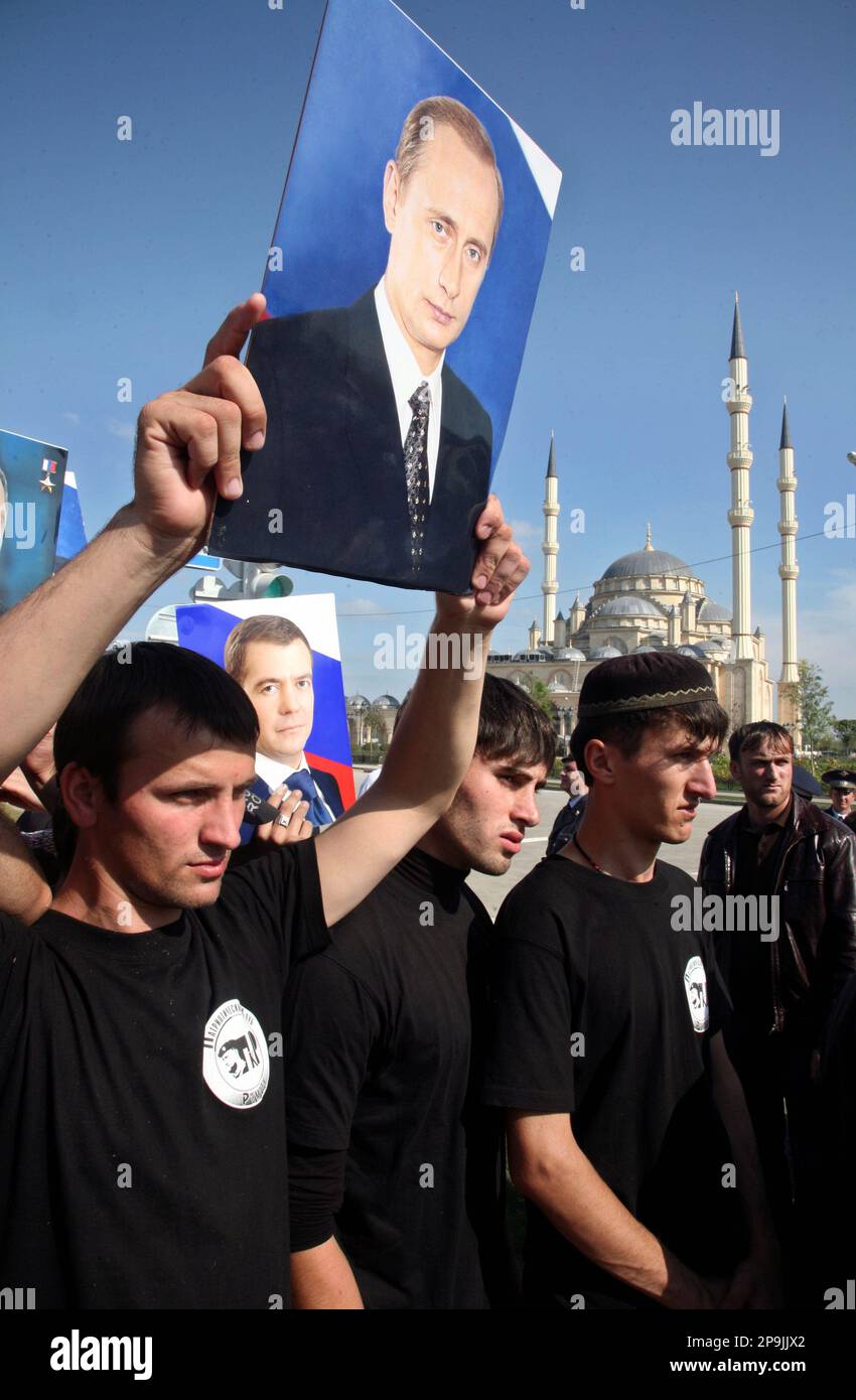Men wearing t-shirts with the logo of Chechnya's Kremlin-backed ...