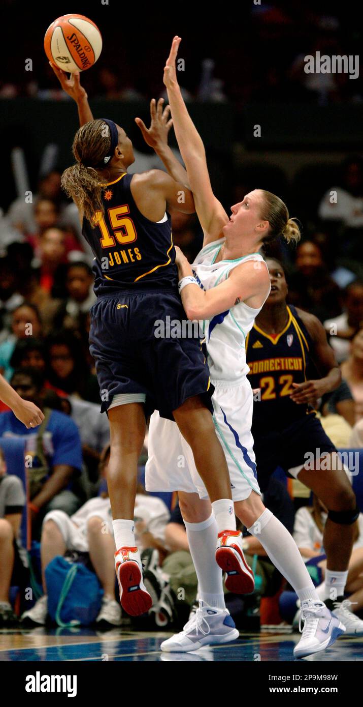 Connecticut Sun's Asjha Jones (15) tries to shoot over New York Liberty ...