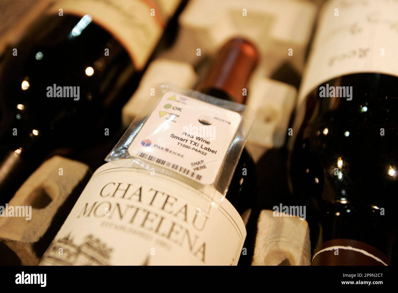 A PakSense smart temperature monitoring label is shown inside a wine ...