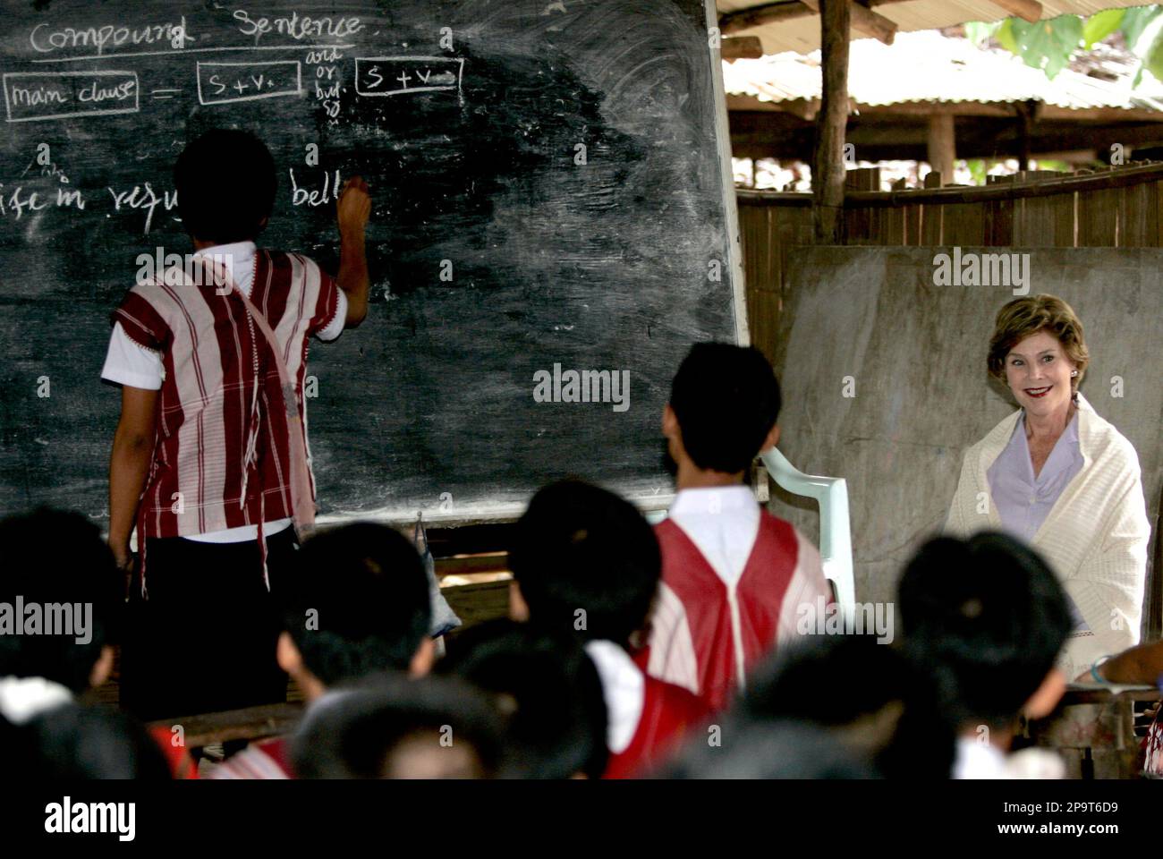 U.S. first lady Laura Bush enters a Karen refugee class room during her ...