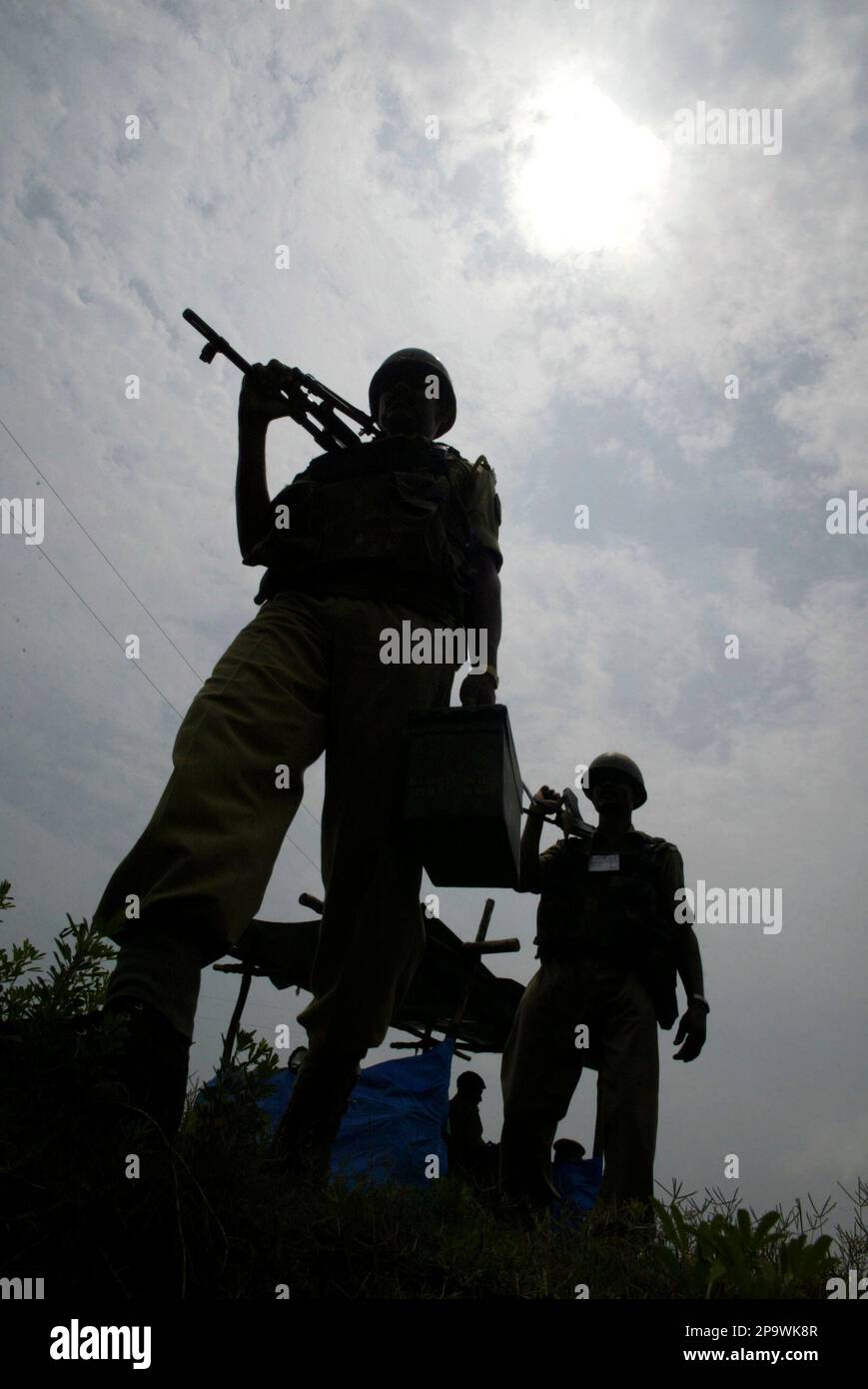 Indian paramilitary soldiers patrol outside the base camp of pilgrims ...