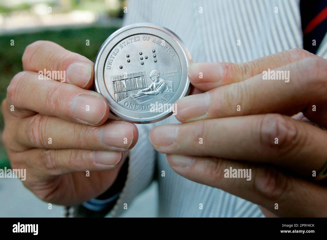 United States Mint Diretor Ed Moy holds a prototype of the design of a ...