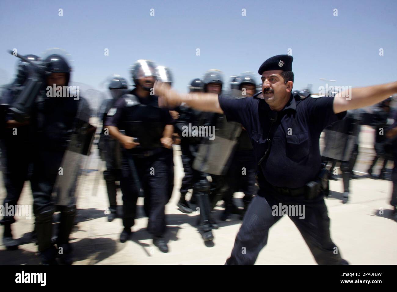 Kurdish riot police demonstrate their skills during a mock riot ...